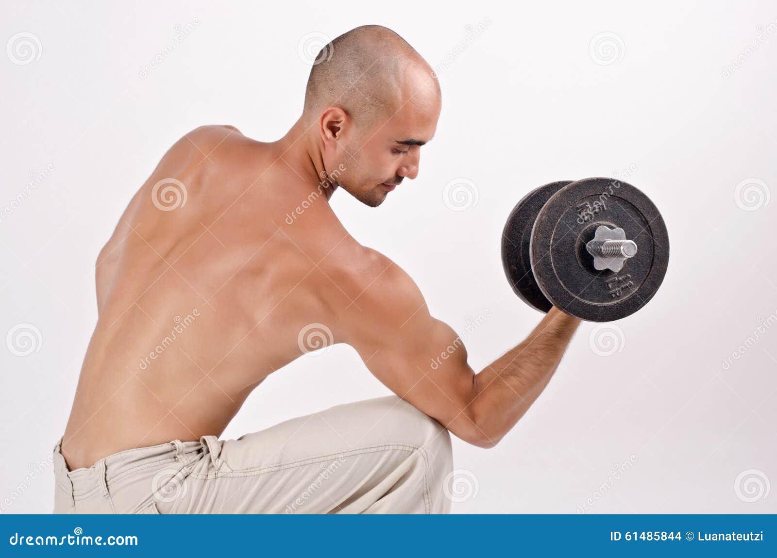 Strong Man Lifting Weights for the Biceps. Stock Photo - Image of ...