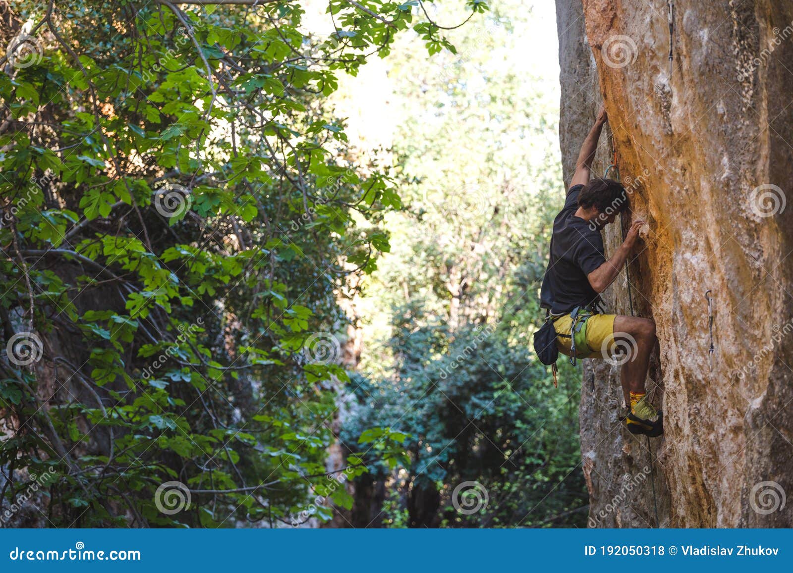 A Strong Man Overcomes a Difficult Climbing Route on a Natural Terrain ...