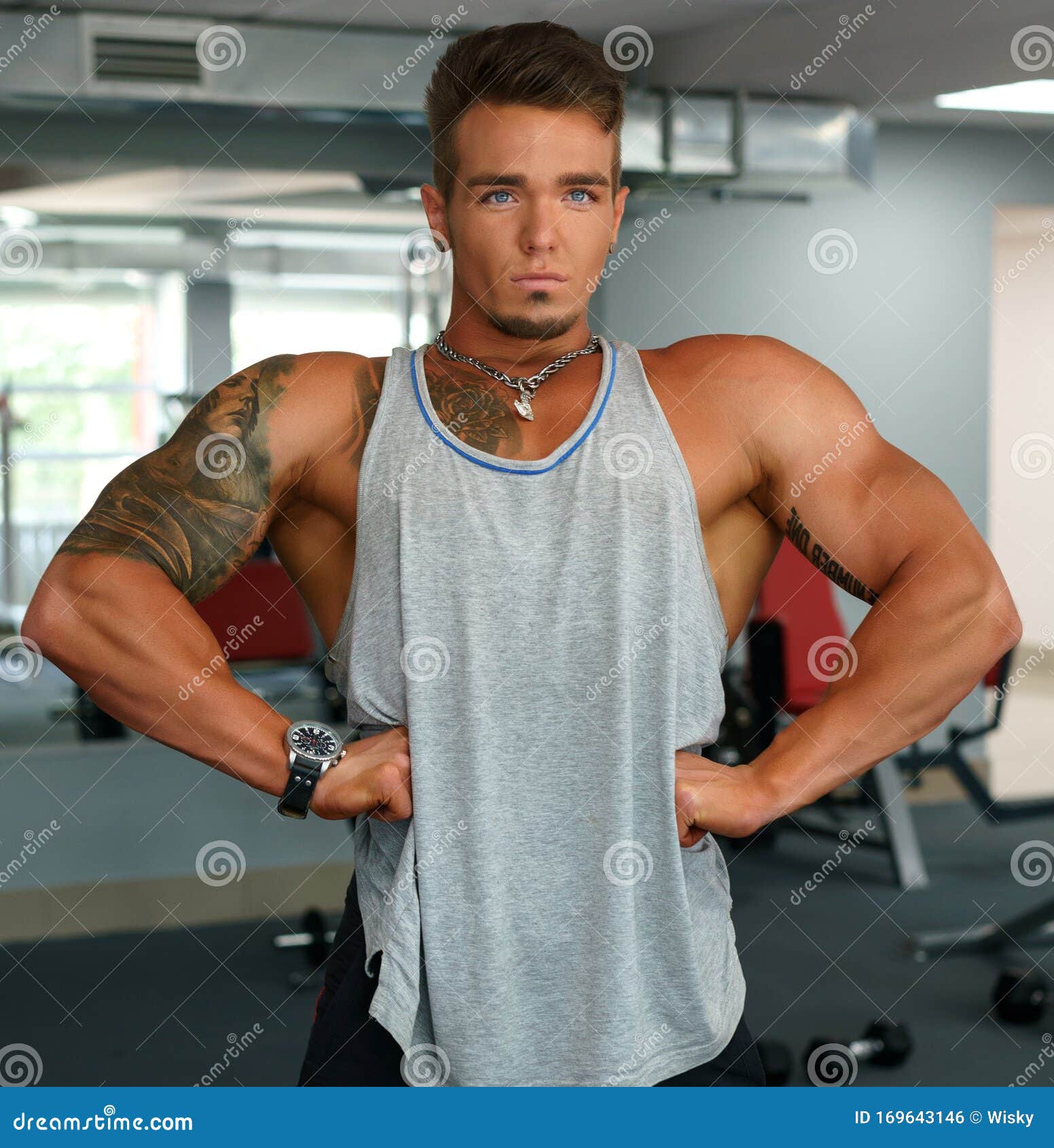 Strong Man Posing with His Muscles Straining Stock Photo - Image of ...