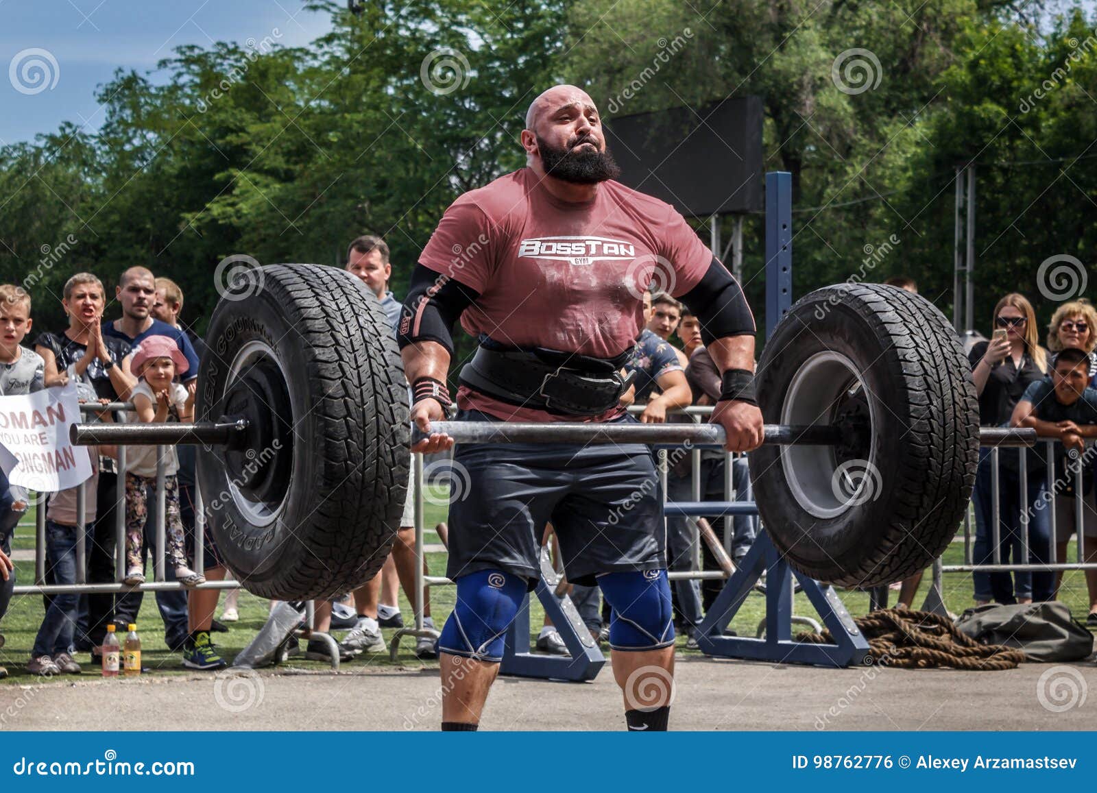 Strong Man Raises a Heavy Barbell. Weightlifting Editorial Photo ... Strong Man Raises a Heavy Barbell. Weightlifting Editorial Photo ...