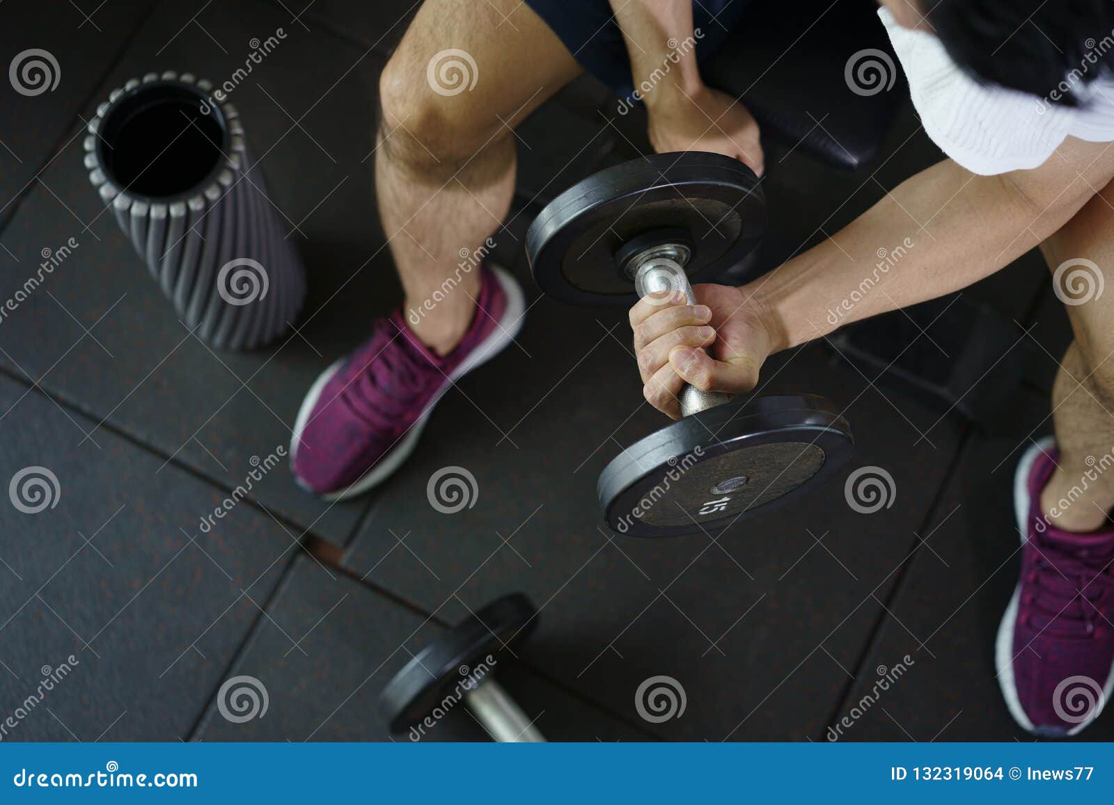 Strong Man Sitting and Workout Lifting Dumbbell for Exercise in Stock ...