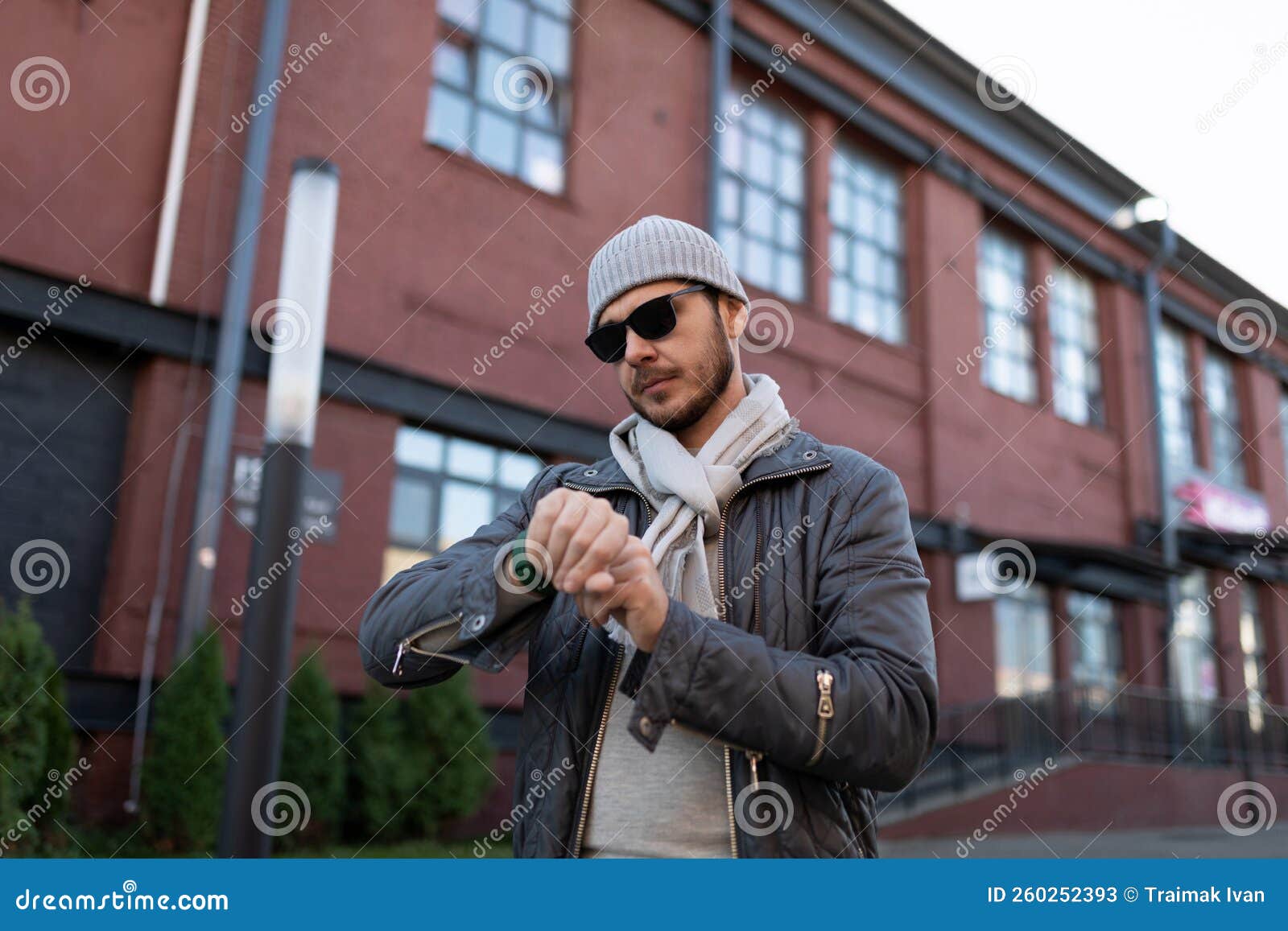 Strong Man on the Street Looking at His Watch Stock Image - Image of ...