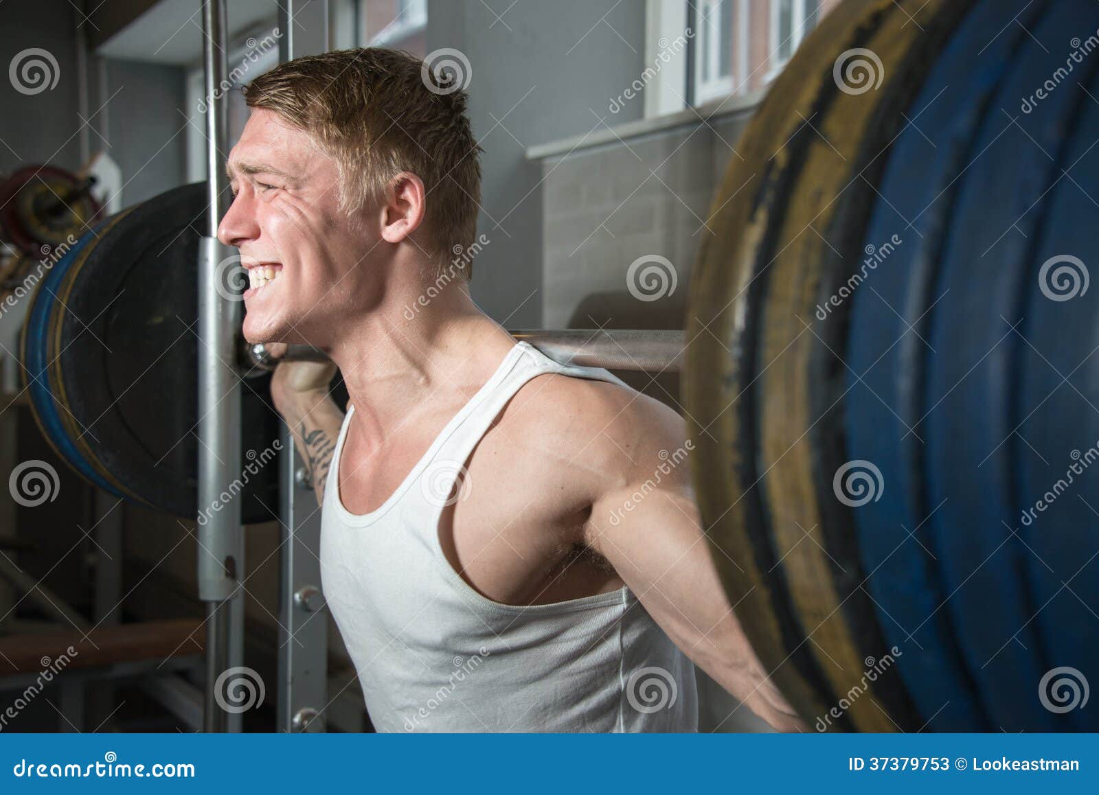 Strong Man Training in Smith Machine Stock Image - Image of facing ...