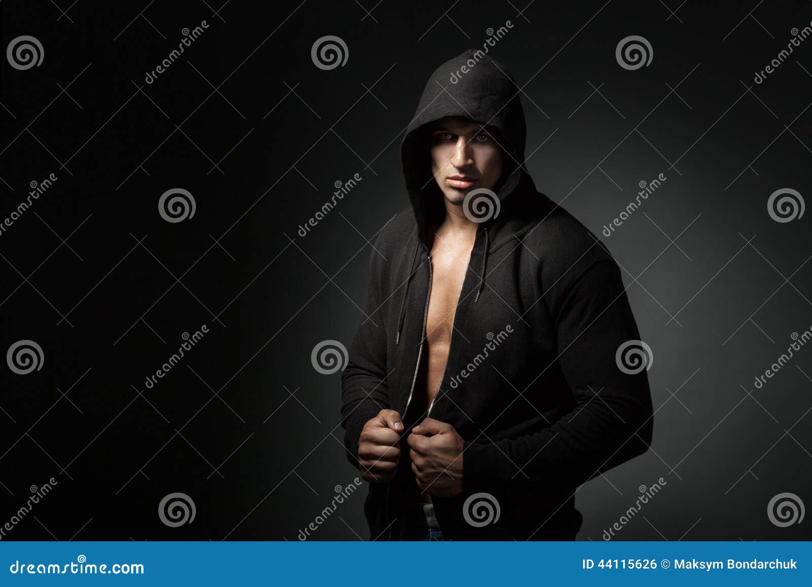 Strong Man Wearing Hoodie Isolated on Black Background Stock Photo ...