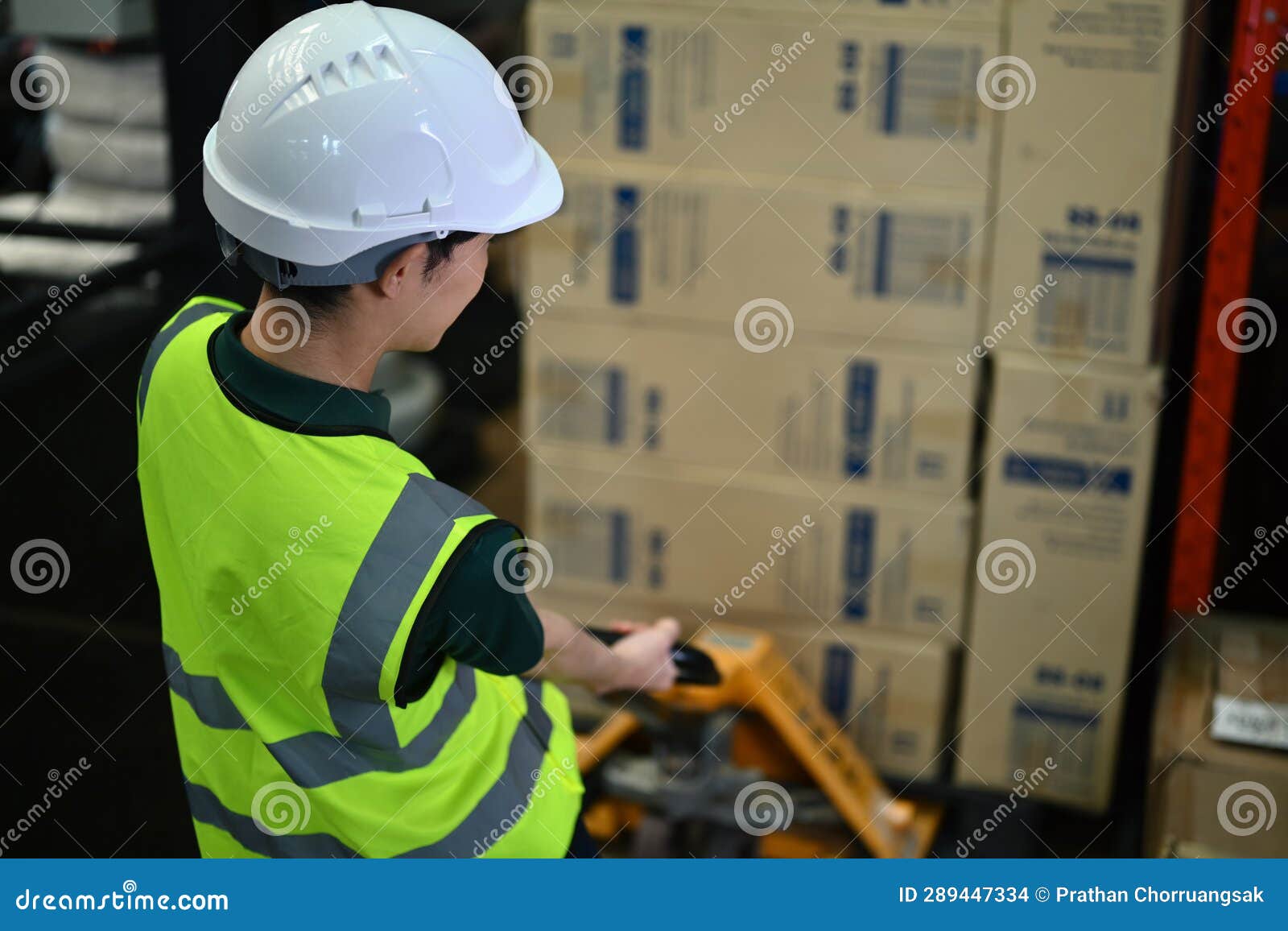 Strong Man Worker Wearing Hardhat and Vests Pulling Pallet Truck ...