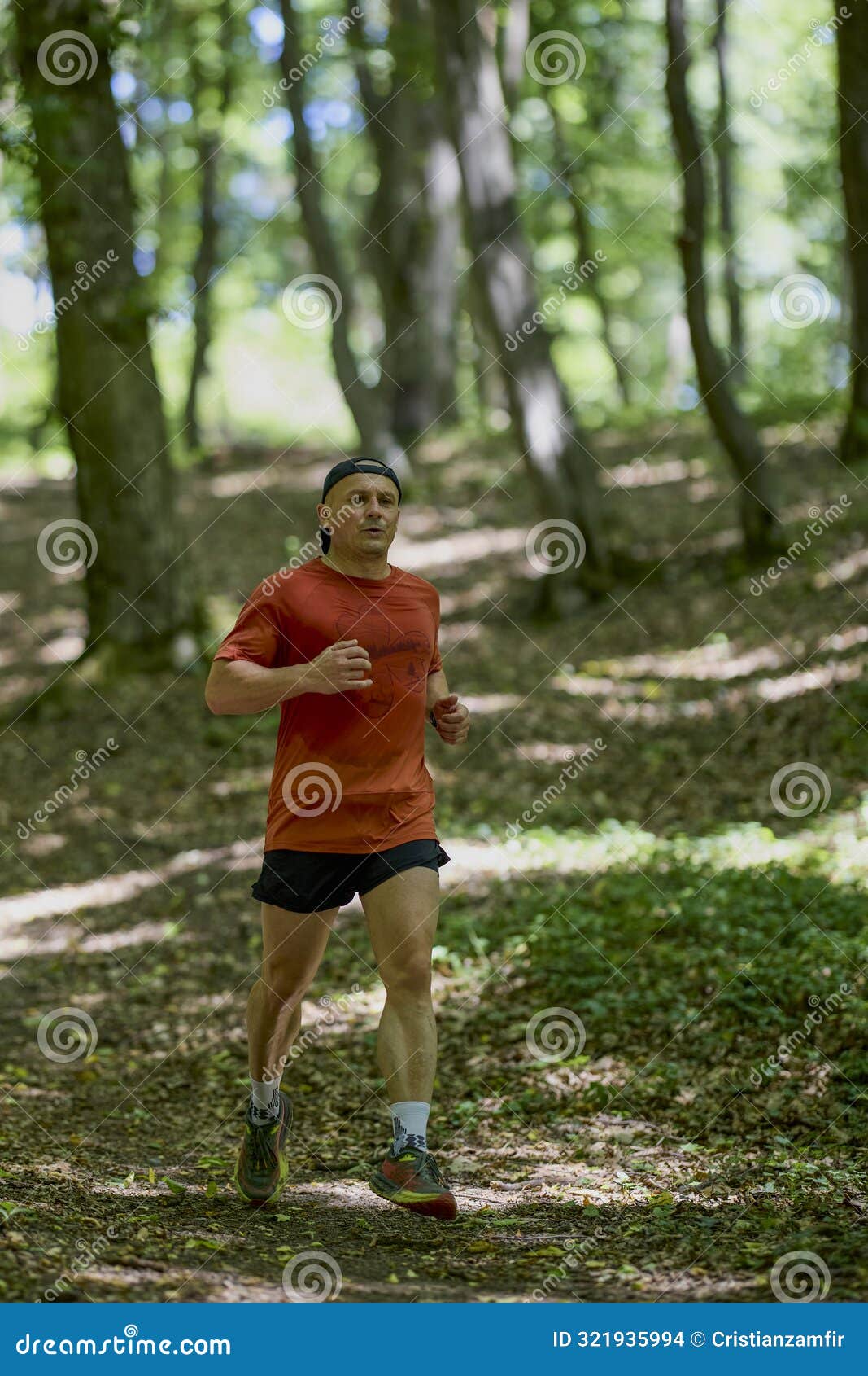 Middle-aged Man Running through the Forest Stock Photo - Image of ...
