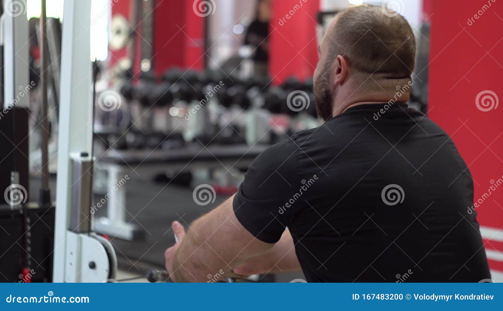 Strong Muscular Man Does Different Kind of Exercises in the Gym Stock ...
