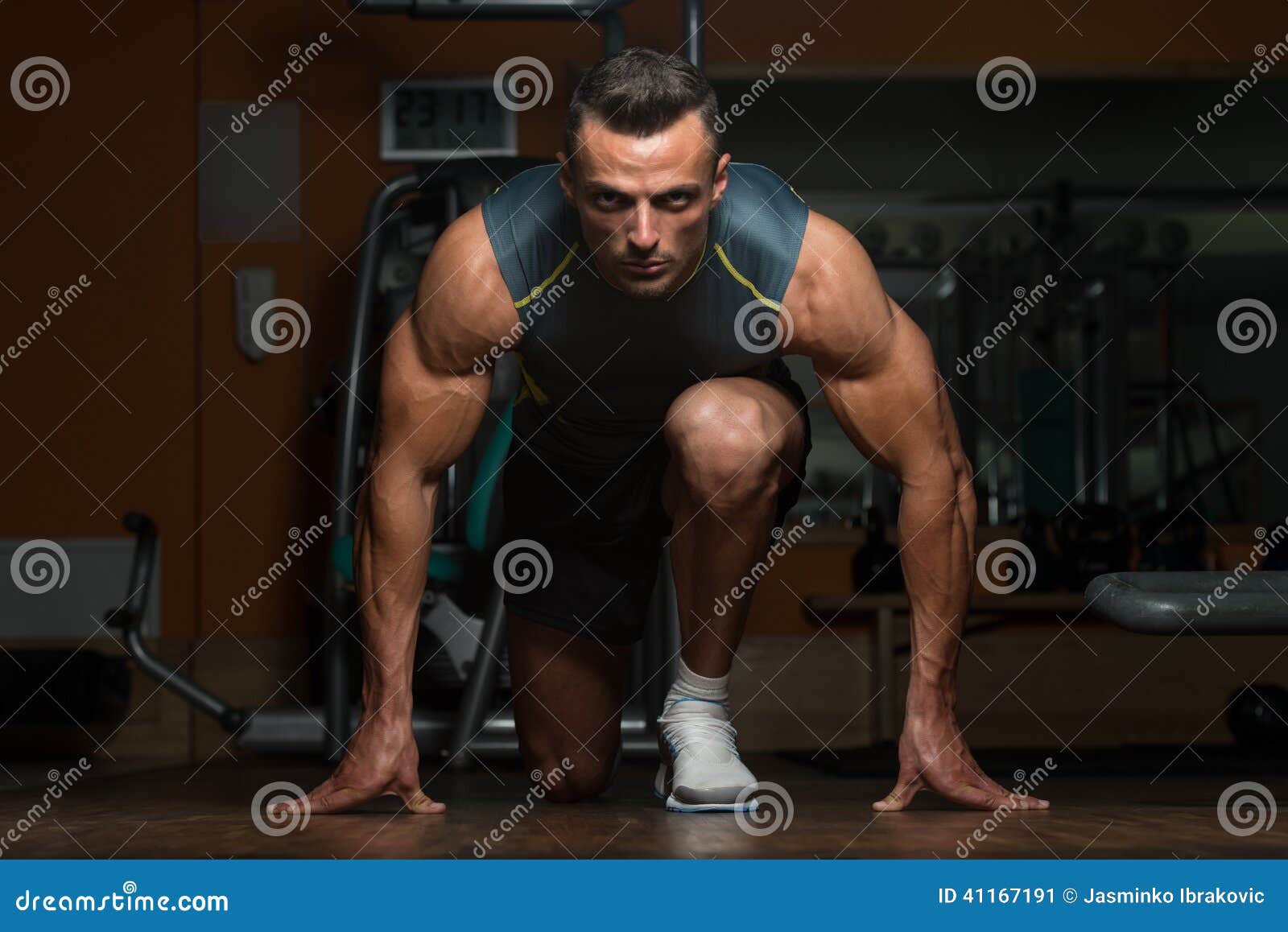 Strong Muscular Men Kneeling on the Floor Stock Image - Image of ...
