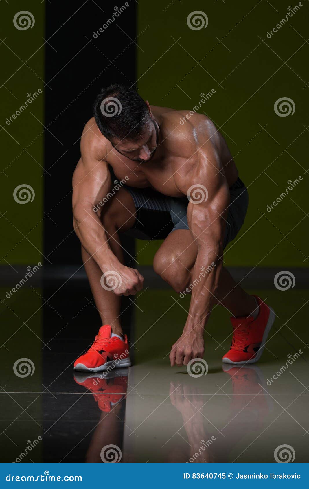 Muscular Man Kneeling On The Floor Shirtless, With Japanese Sword Stock ...