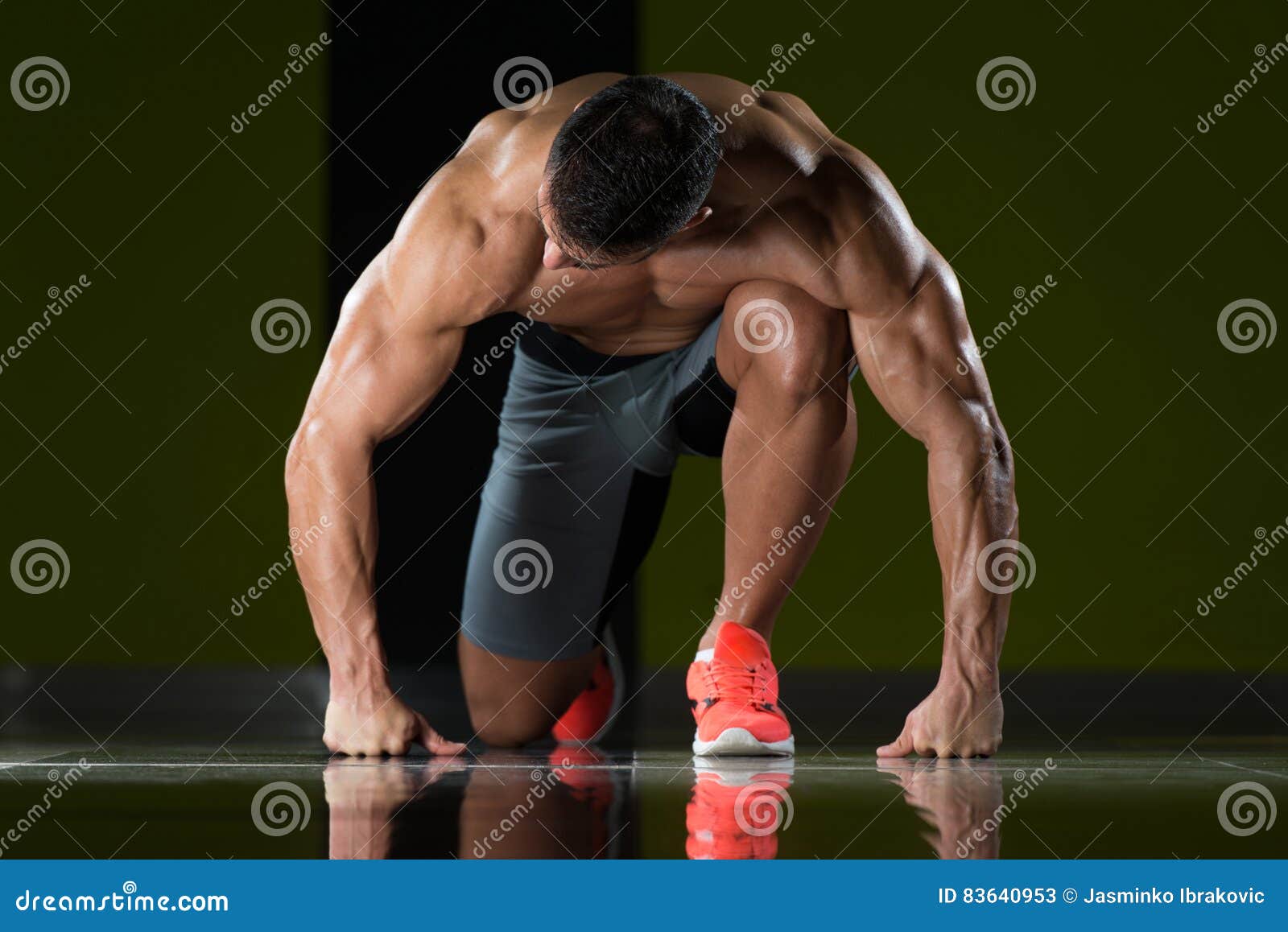 Strong Muscular Men Kneeling on the Floor Stock Image - Image of people ...