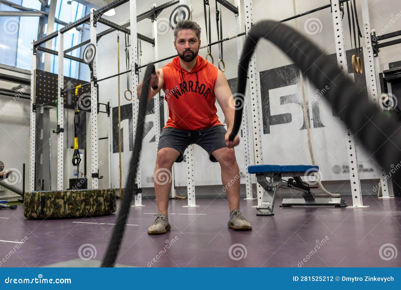 Strong Powerful Man Working Out with Battle Ropes at Gym, Developing ...