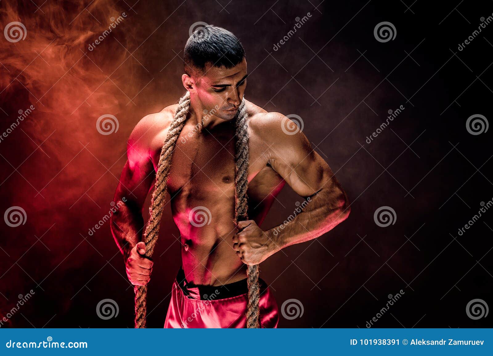 Strong man with rope stock image. Image of athletic - 101938391