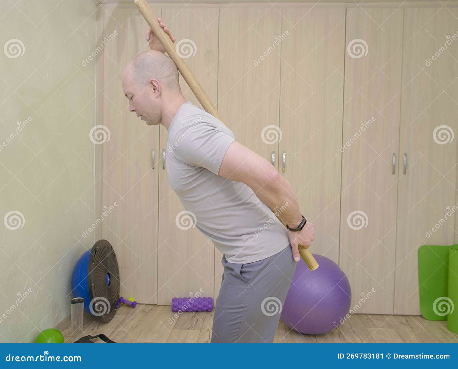 Strong Sport Man Holds a Gymnastic Stick on Back. Correct Posture ...