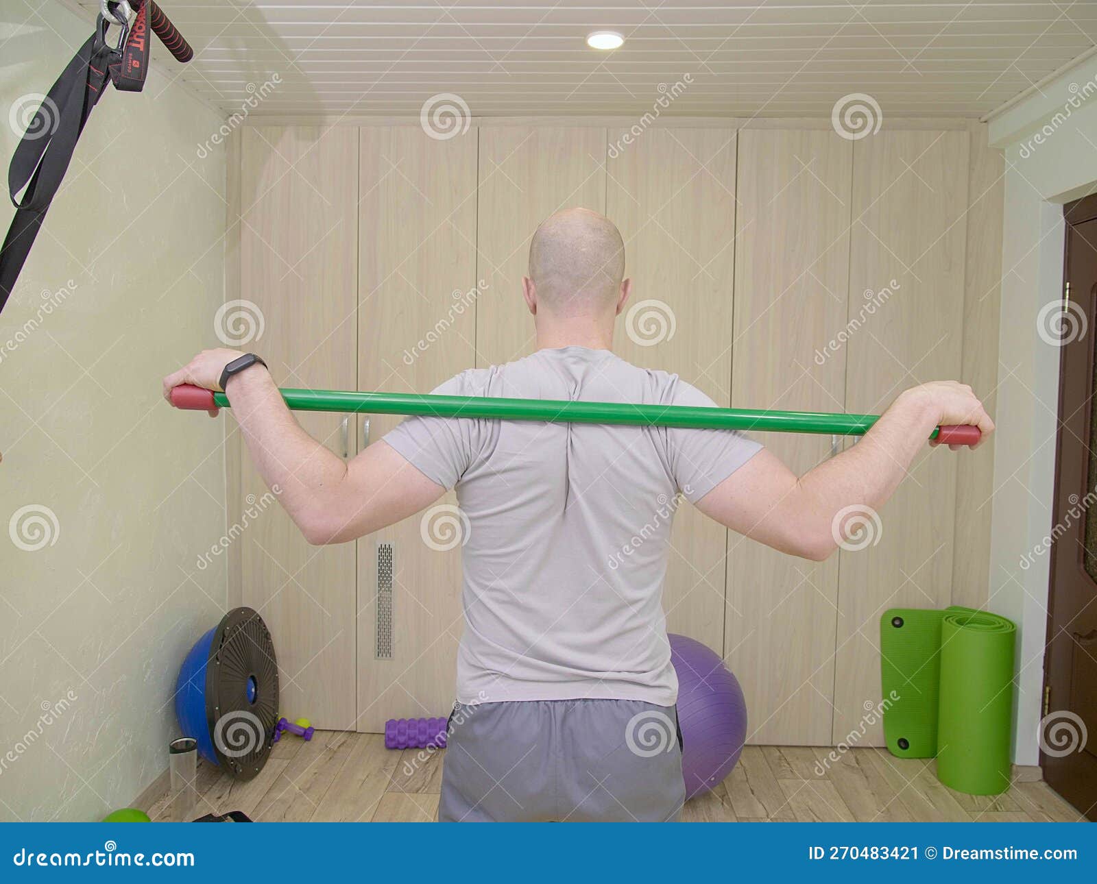 Strong Sport Man Holds a Gymnastic Stick on Back. Correct Posture ...