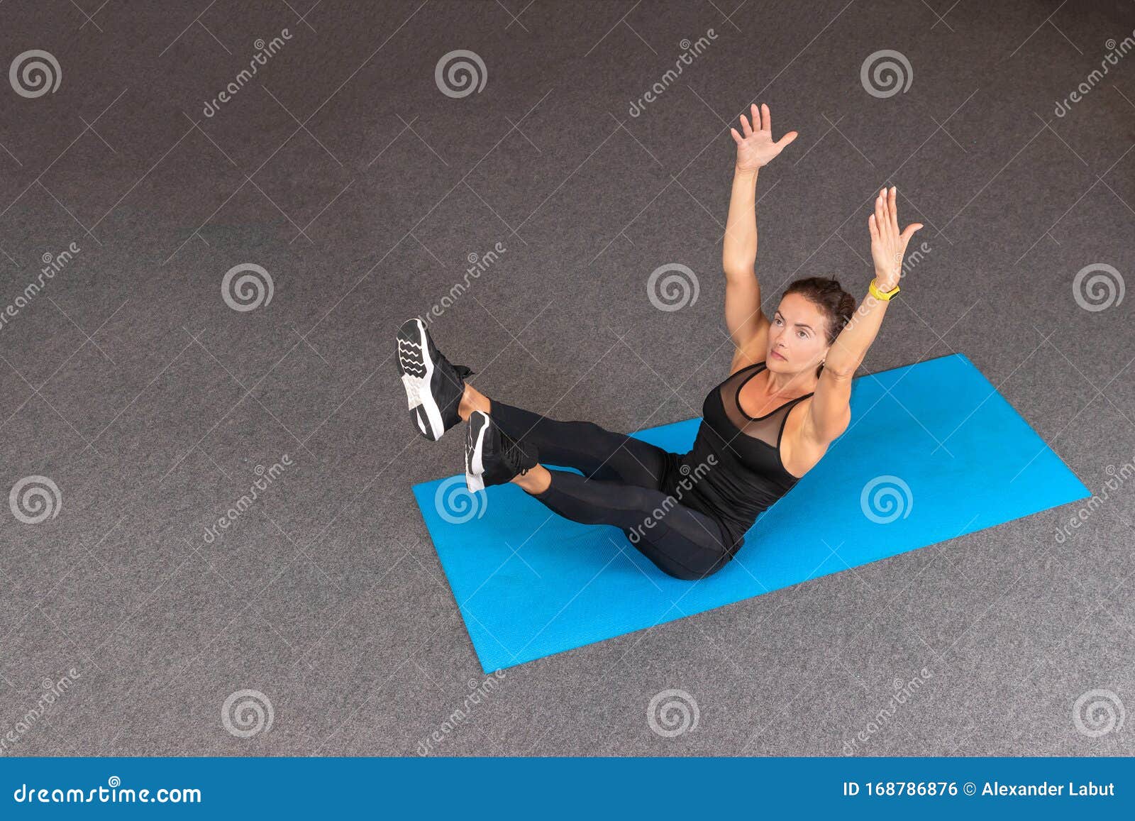 Strong And Sporty Fitness Woman In Black Sportswear Doing Abdominal
