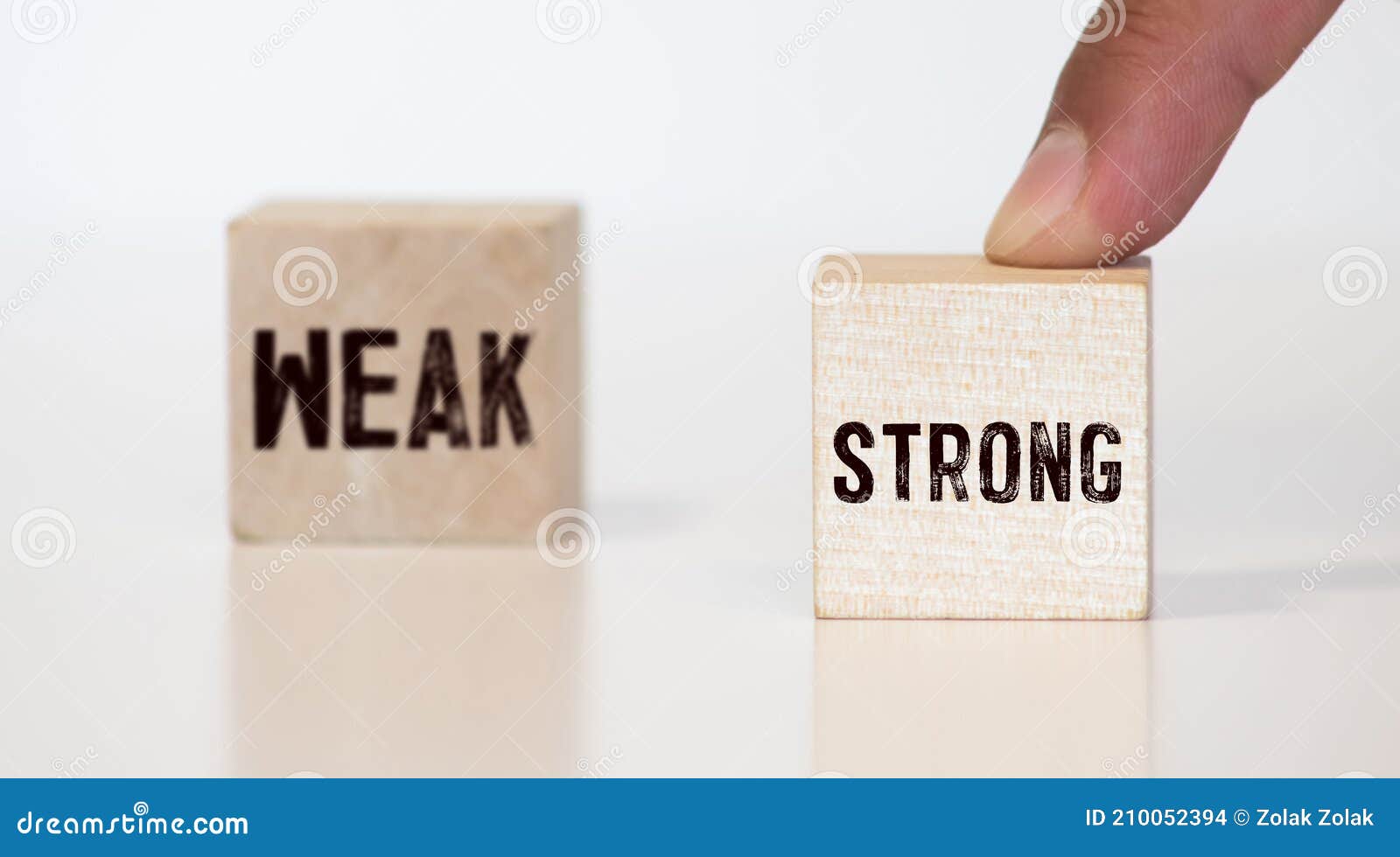 Strong Versus Weak Text on Wooden Block Stock Photo - Image of notepad ...