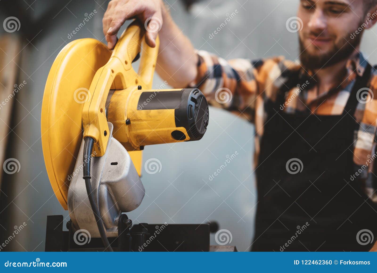 Strong Worker Using Angular Grinding Machine in Workshop. Servicing of ...