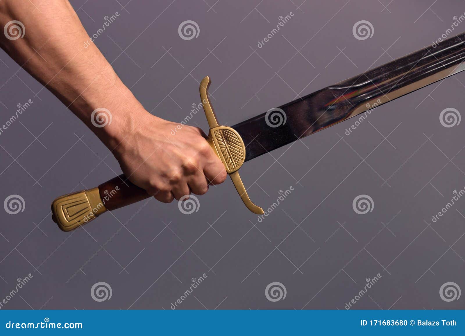 Young Athletic Man Holding His Sword Stock Photo - Image of honor, safe ...
