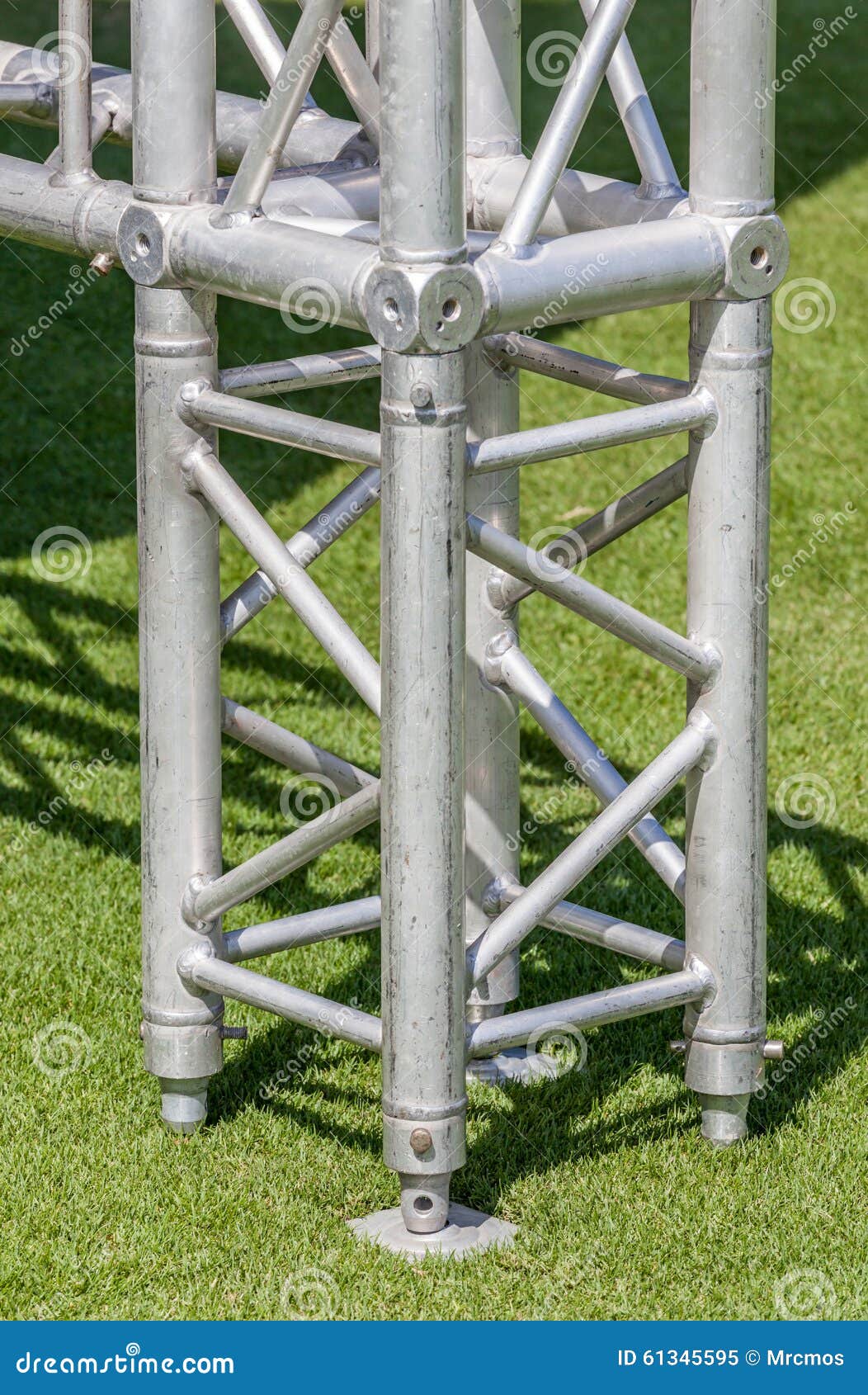 Structural Detail of a Lighting Post Base on Green Grass. Stock Image ...