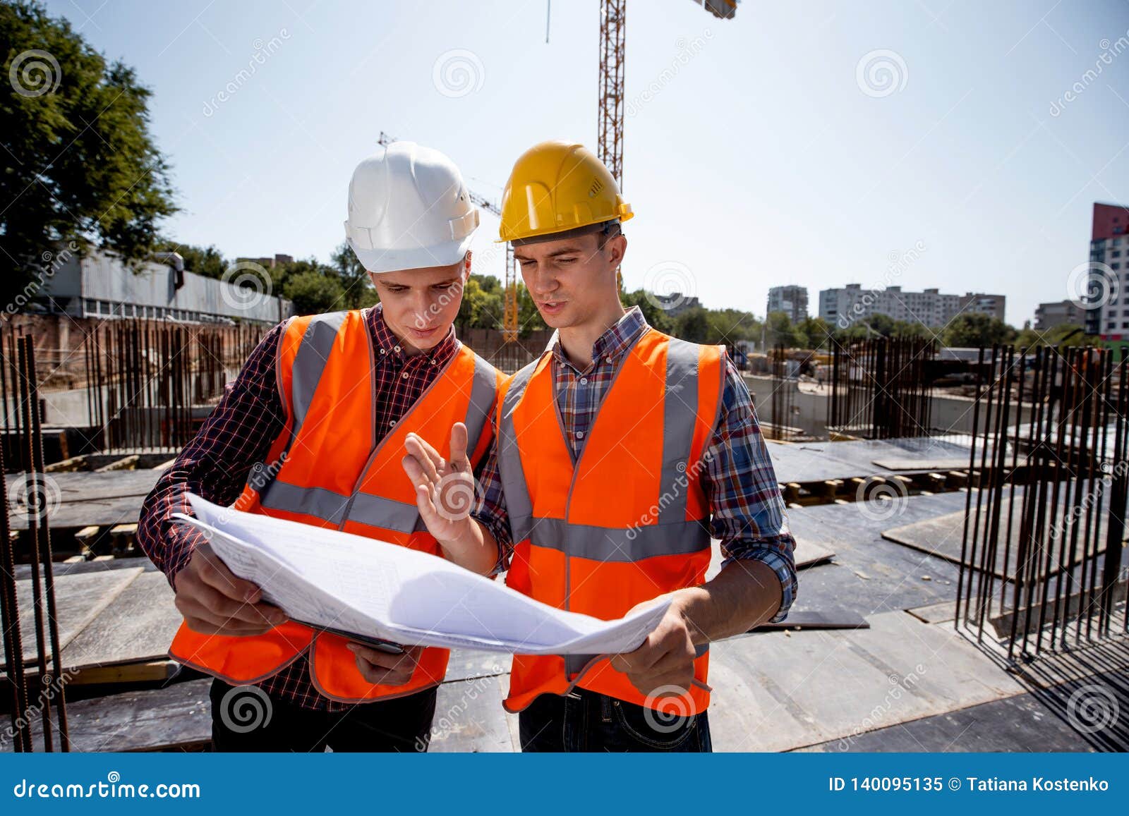 Structural Engineer and Construction Manager Dressed in Orange Work ...