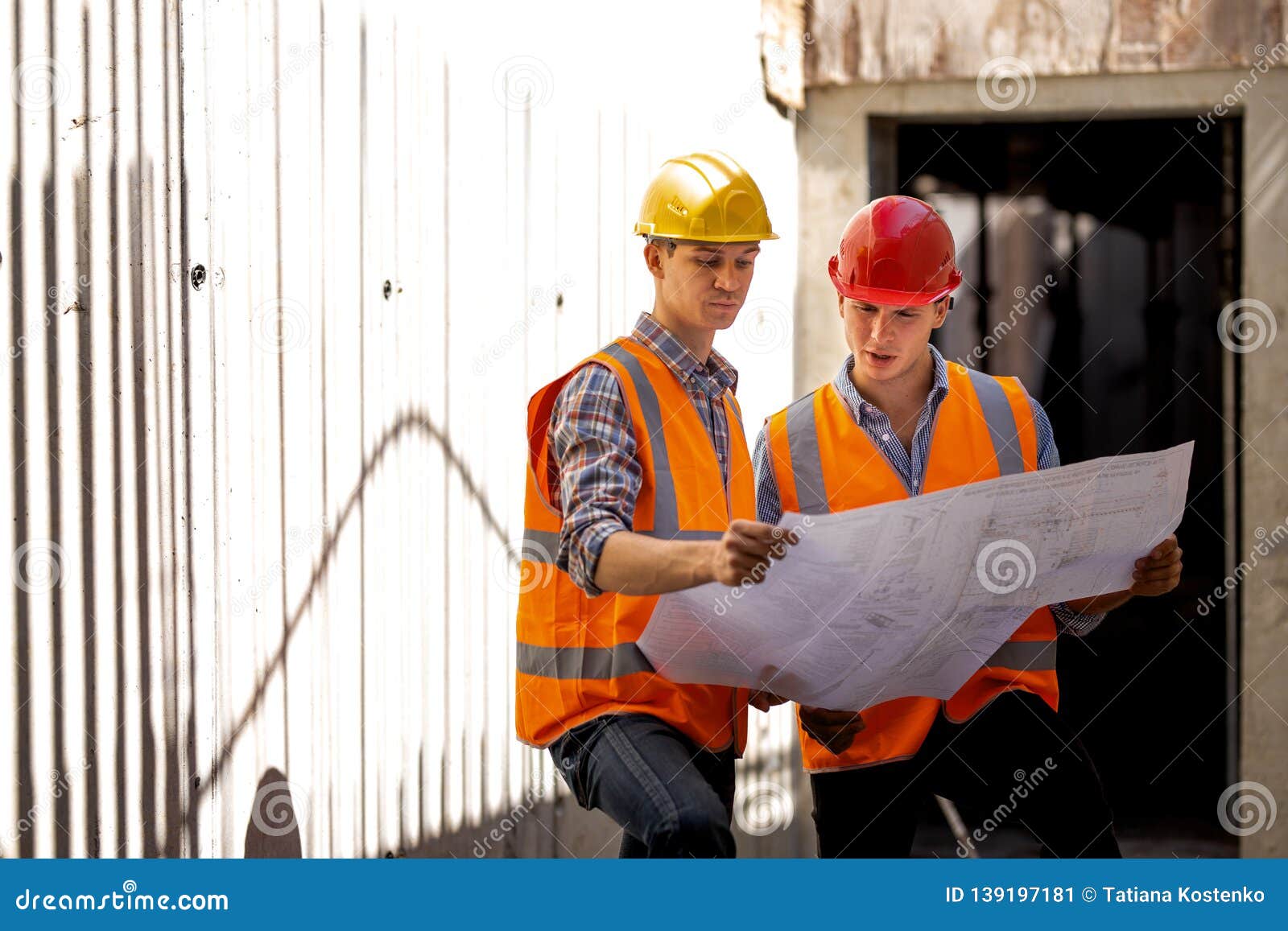 Structural Engineer and Construction Manager Dressed in Work Clothes ...