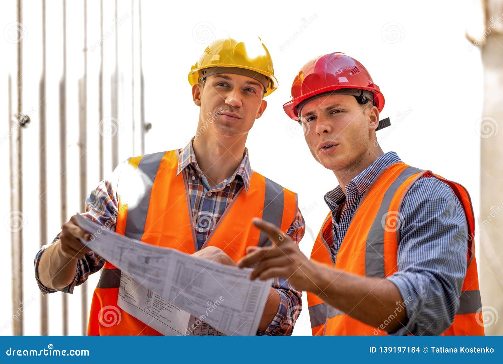 Structural Engineer and Construction Manager Dressed in Work Clothes ...