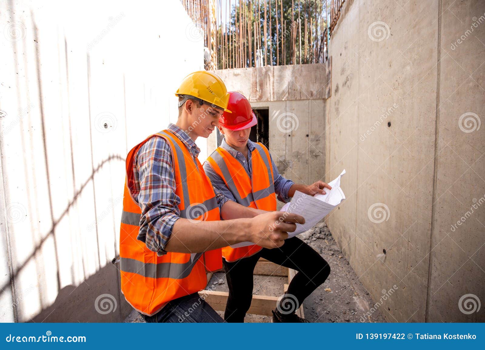 Structural Engineer and Construction Manager Dressed in Work Clothes ...