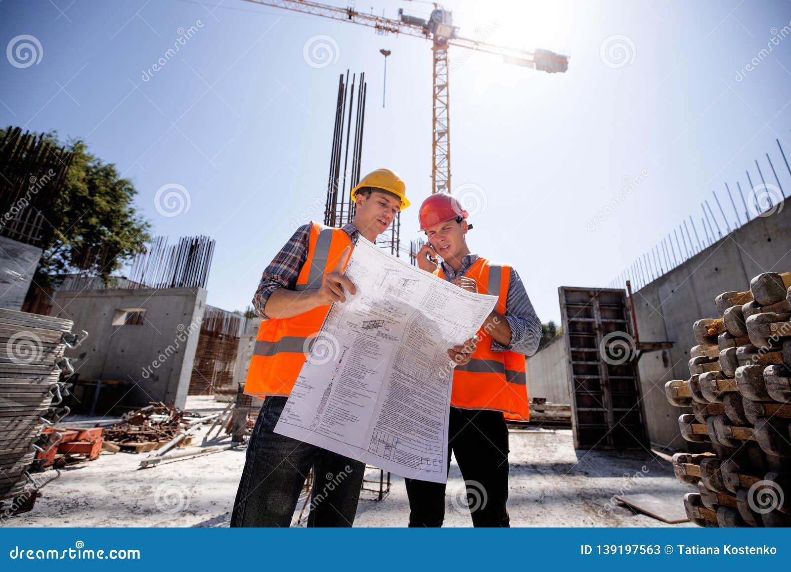 Structural Engineer and Construction Manager in Orange Work Vests and ...