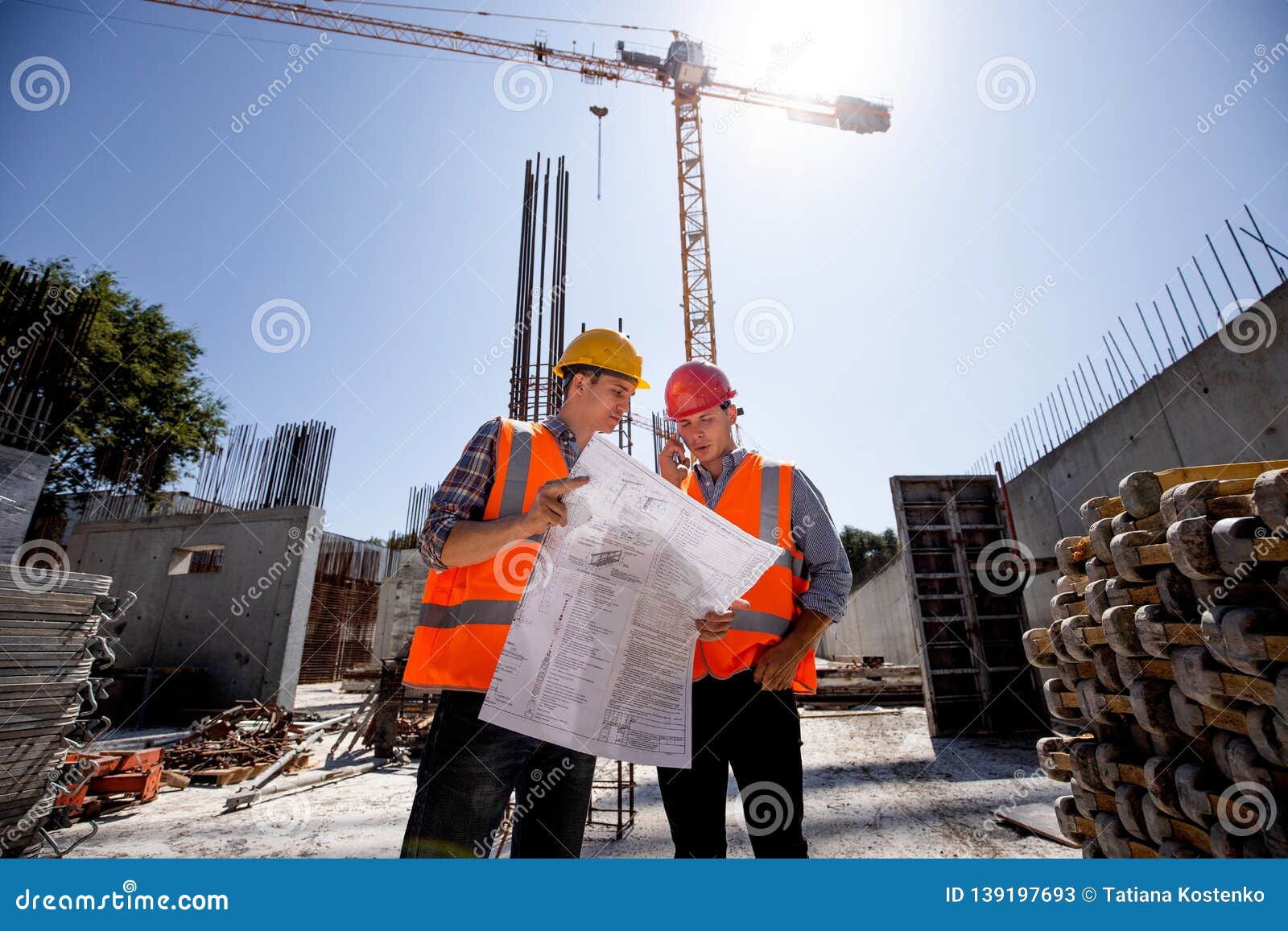 Structural Engineer and Construction Manager in Orange Work Vests and ...
