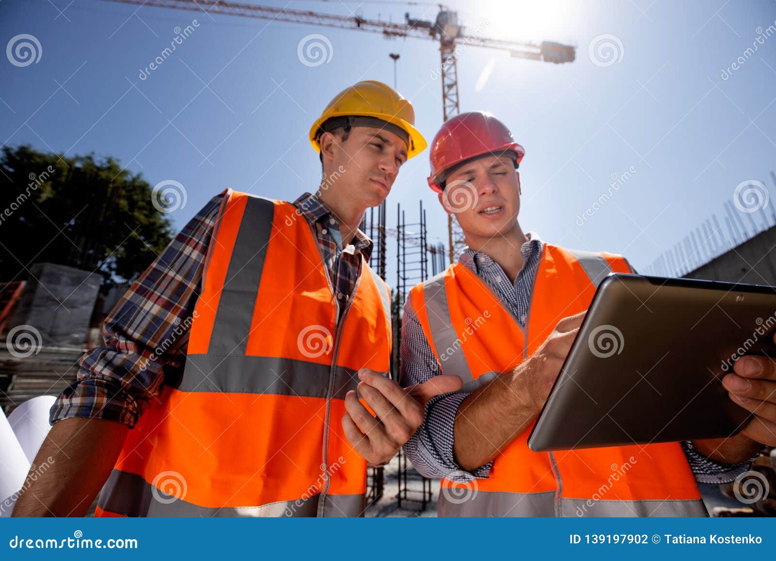 Structural Engineer and Construction Manager in Orange Work Vests and ...