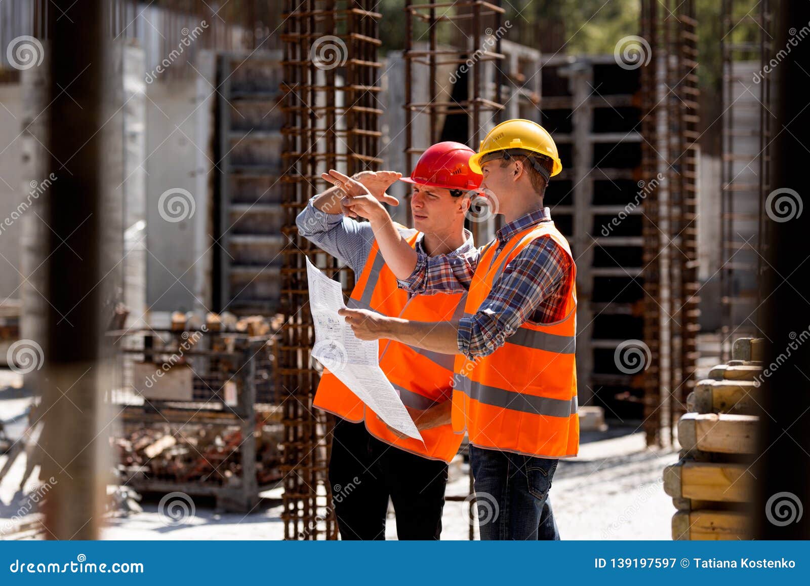 Structural Engineer and Construction Manager in Orange Work Vests and ...