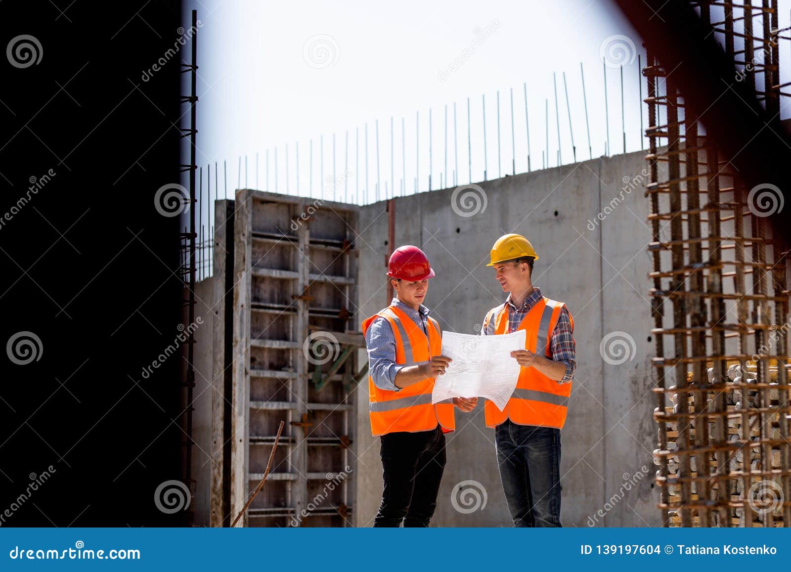 Structural Engineer and Construction Manager in Orange Work Vests and ...