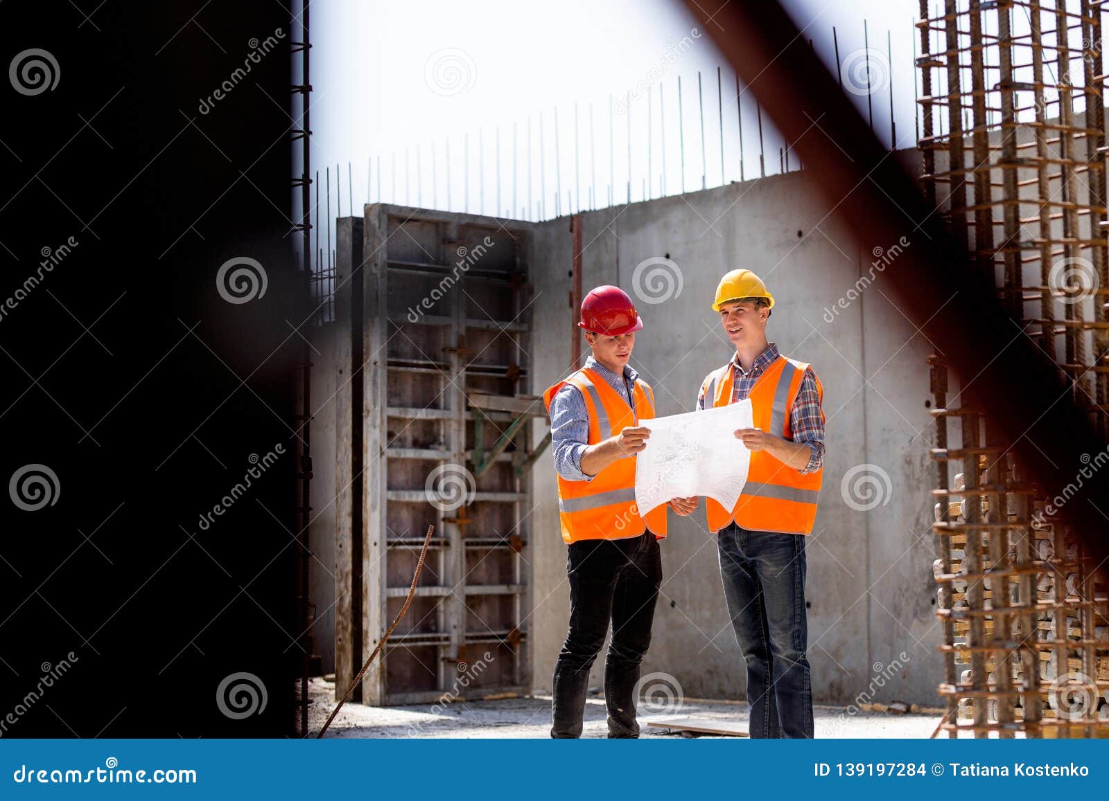 Structural Engineer and Construction Manager in Orange Work Vests and ...