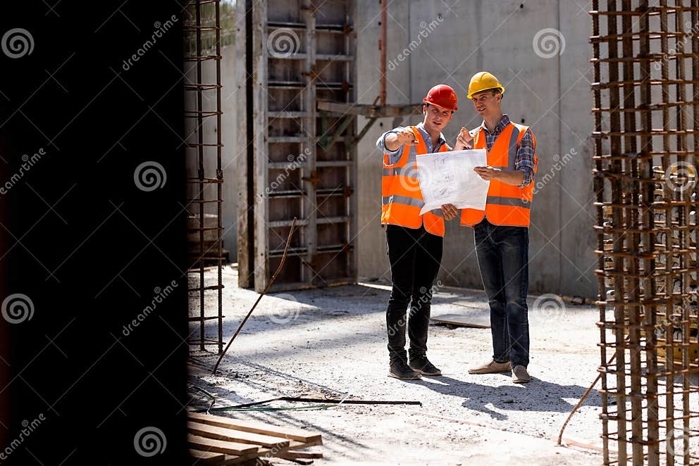 Structural Engineer and Construction Manager in Orange Work Vests and ...