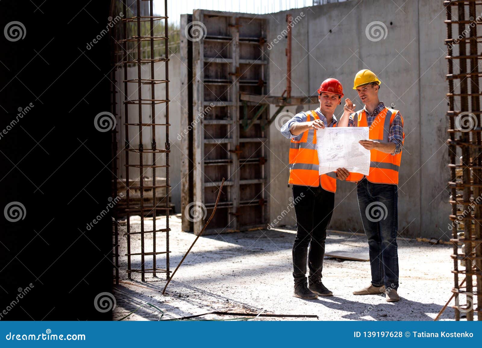 Structural Engineer and Construction Manager in Orange Work Vests and ...