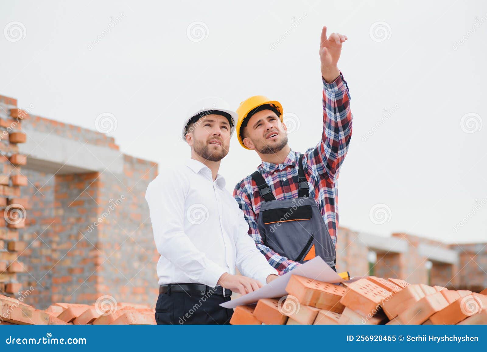 Structural Engineer and Foreman Worker Discuss, Plan Working for the ...