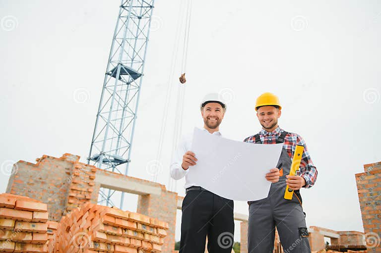 Structural Engineer and Foreman Worker Discuss, Plan Working for the ...