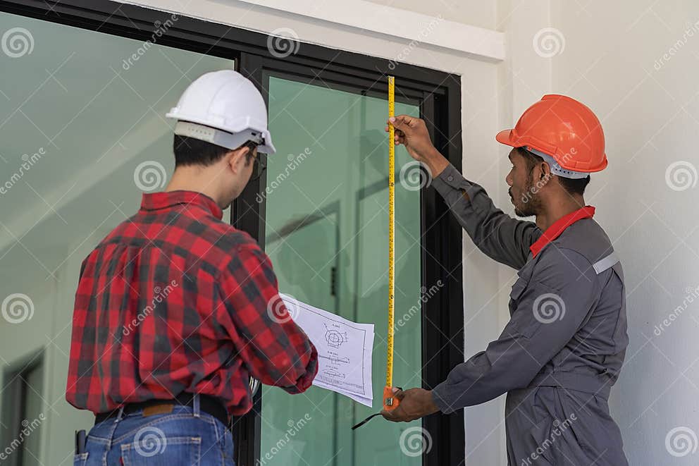 Structural Engineer and Foreman Worker with Touchpad Talking Work Plan ...