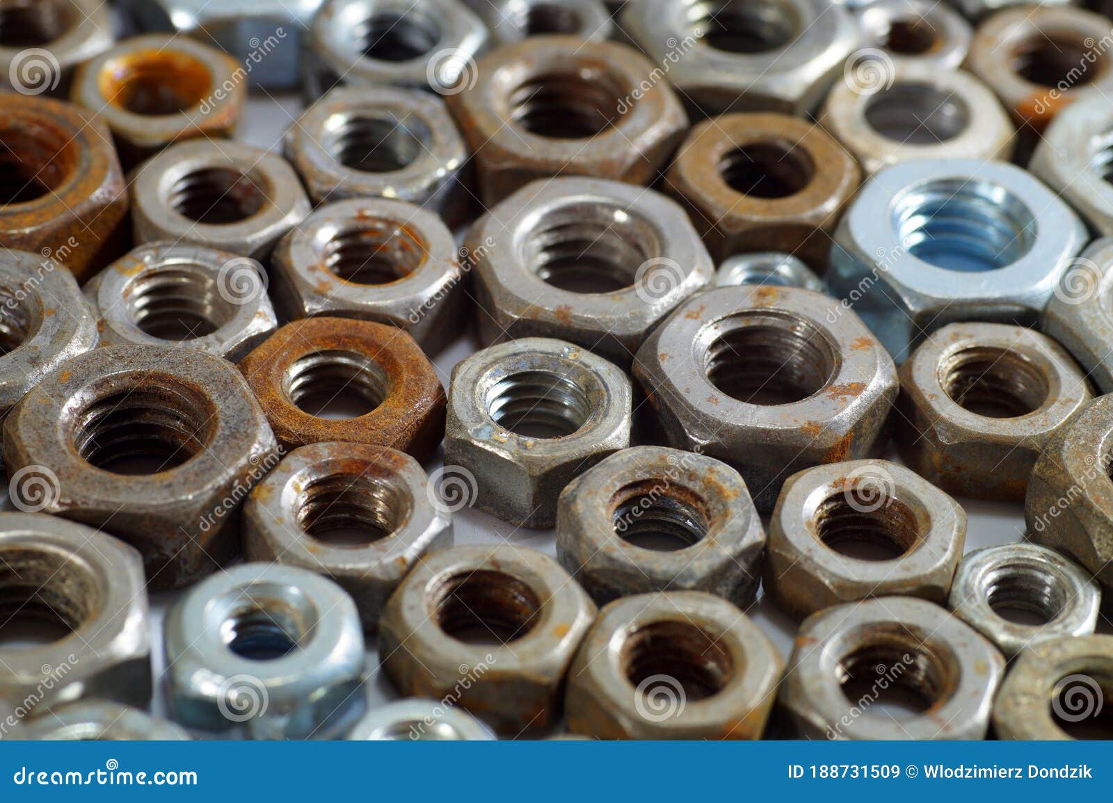 Metal. the Structure Consists of Metal Nuts. Different Sizes and ...