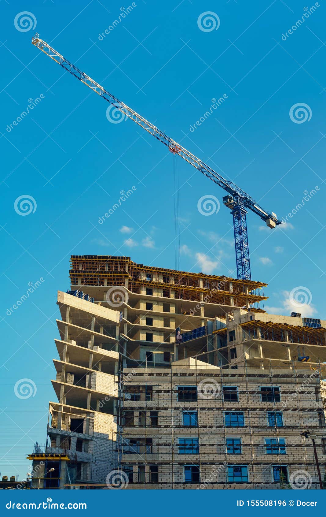 Structure of a New Concrete Building and Hoisting Crane Stock Photo ...
