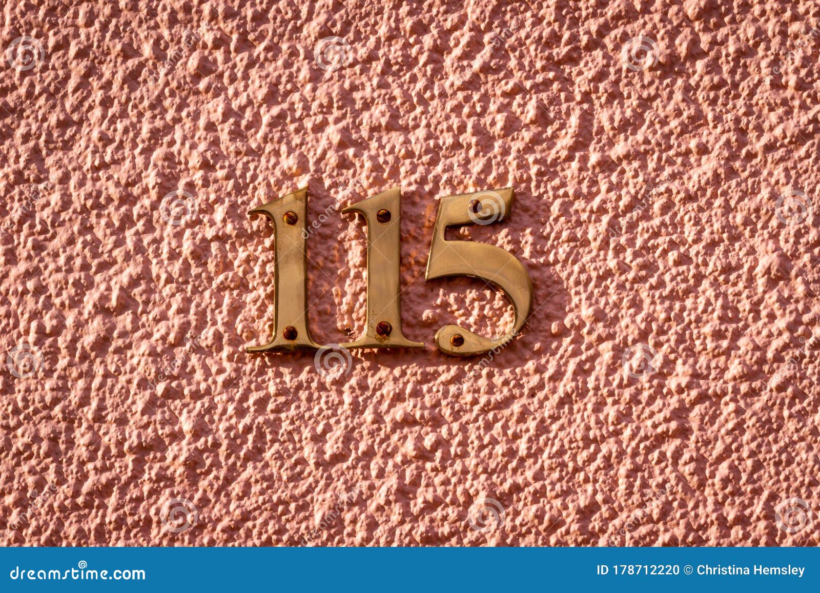 Golden House Number 115 on a Pink Plaster Wall Stock Photo - Image of ...