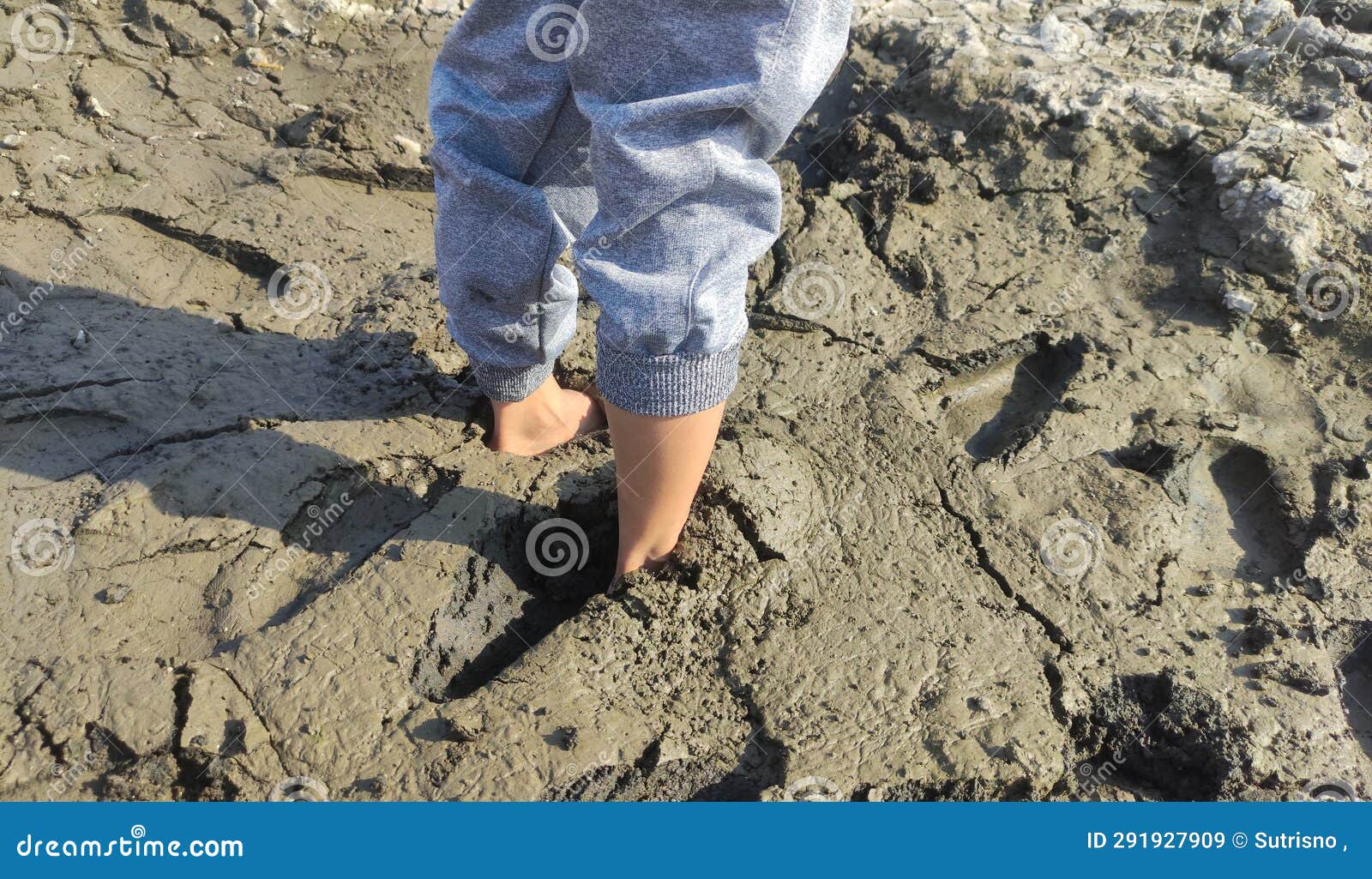 Stuck in the Mud. Close-up View of Feet Walking through Muddy Path ...