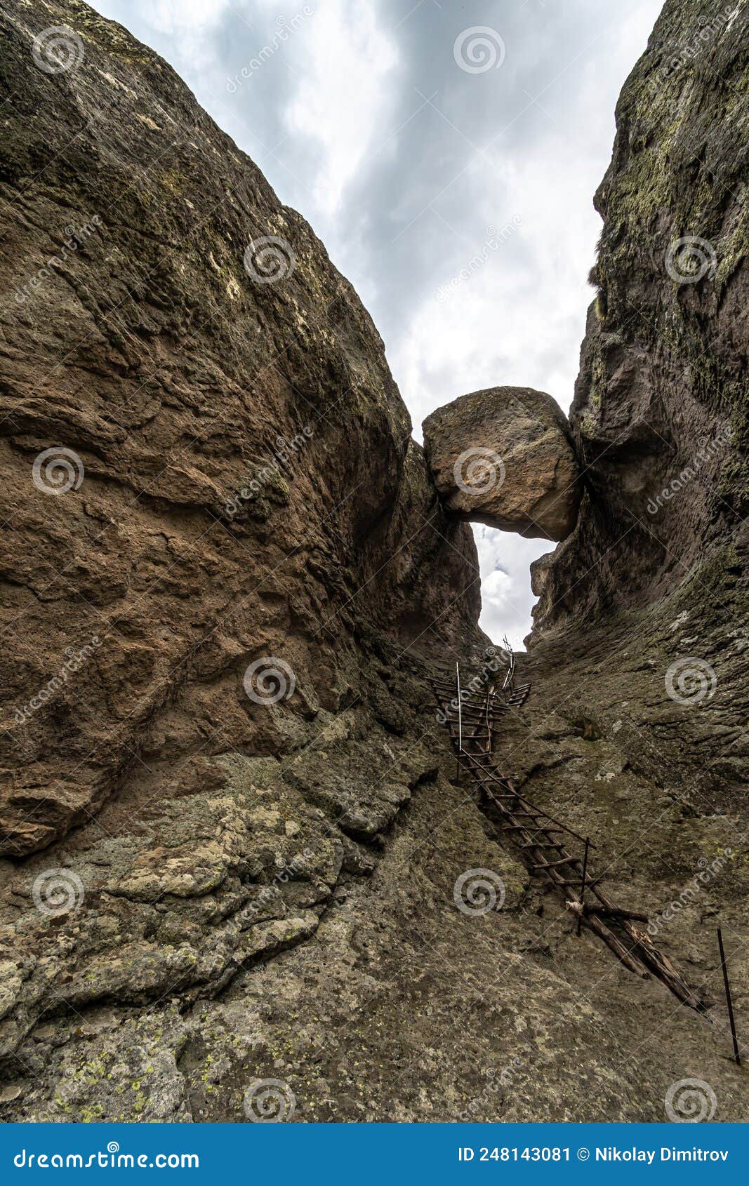 Stuck stone in the rocks stock image. Image of rock - 248143081