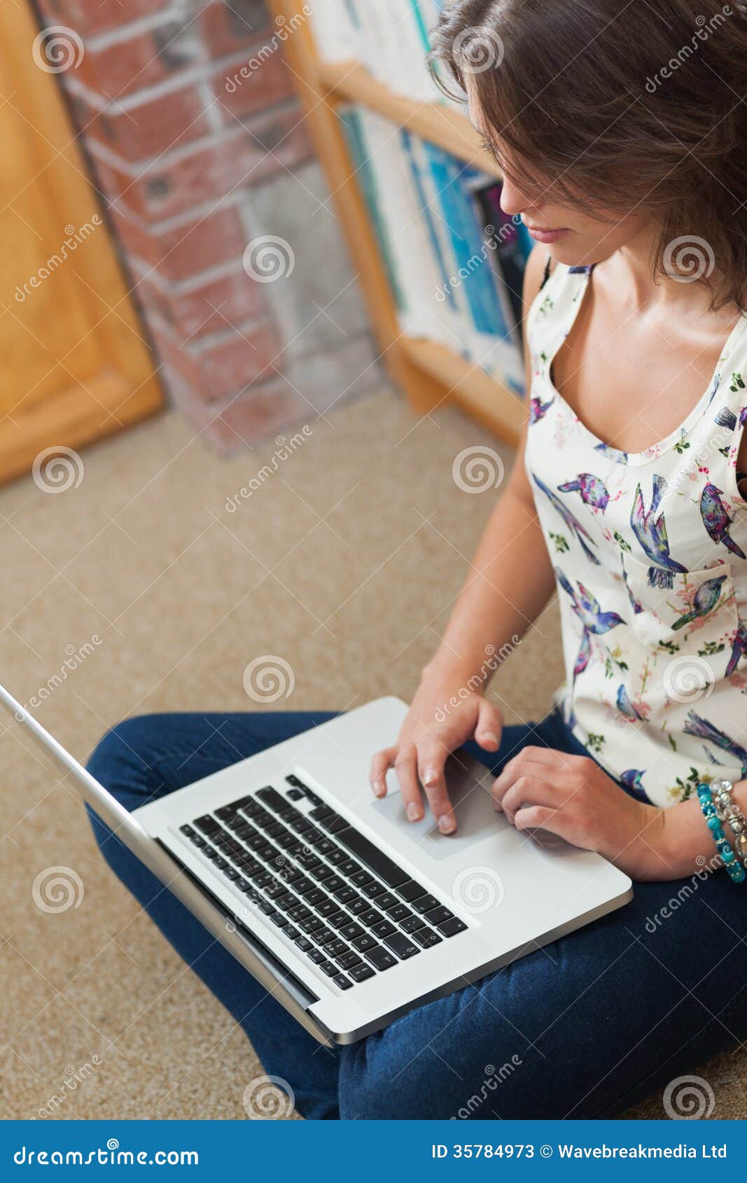 Student Against Bookshelf Using Laptop on the Library Floor Stock Image ...
