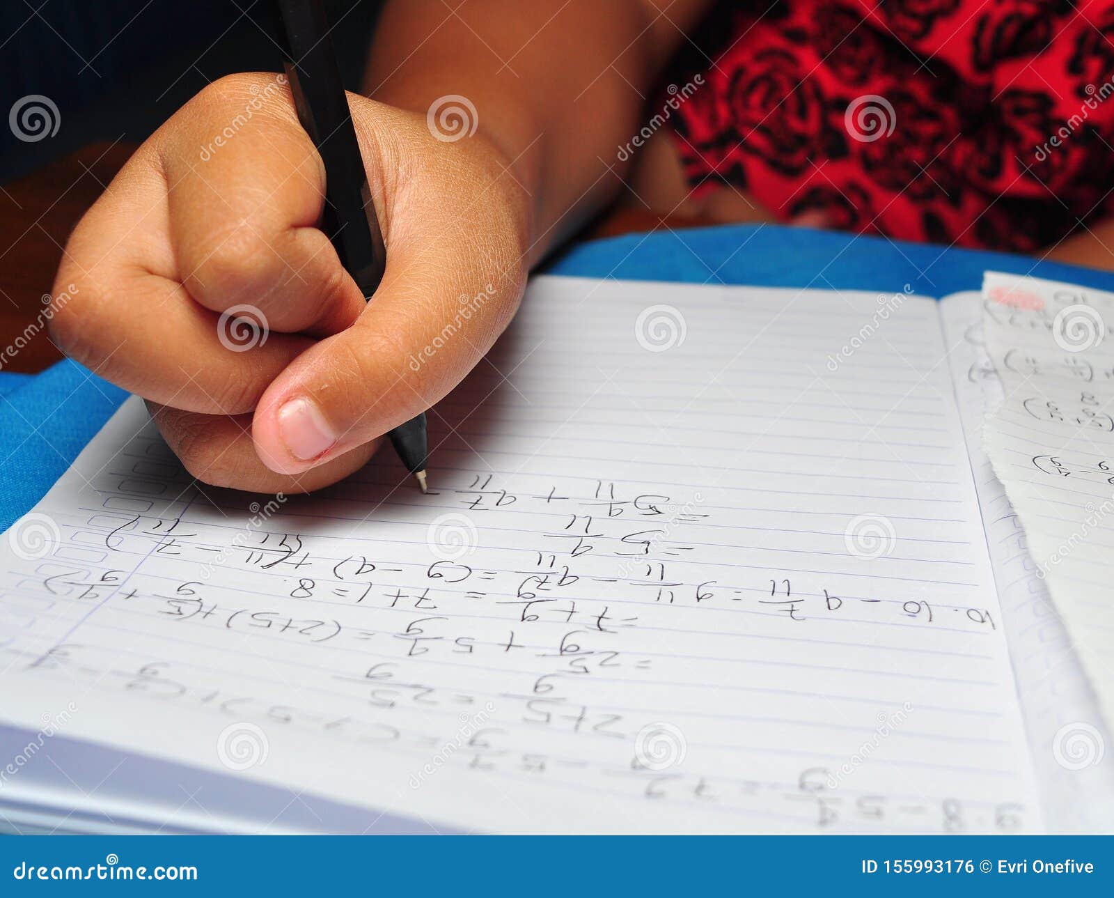 Student Answer Mathematic Question Sheet. Hand Holding Pen Writing And ...