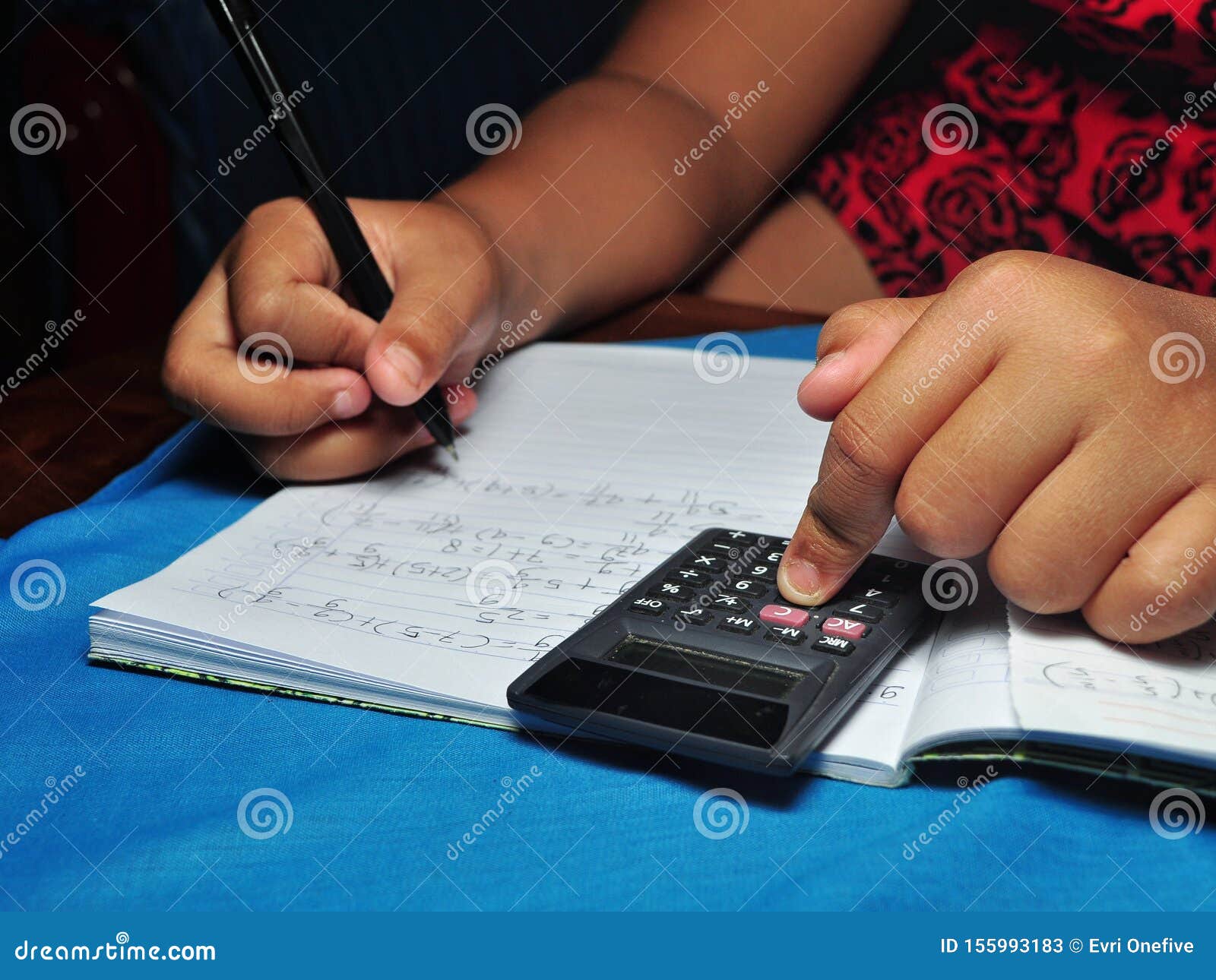 Student Answer Mathematic Question Sheet. Hand Holding Pen Writing And ...