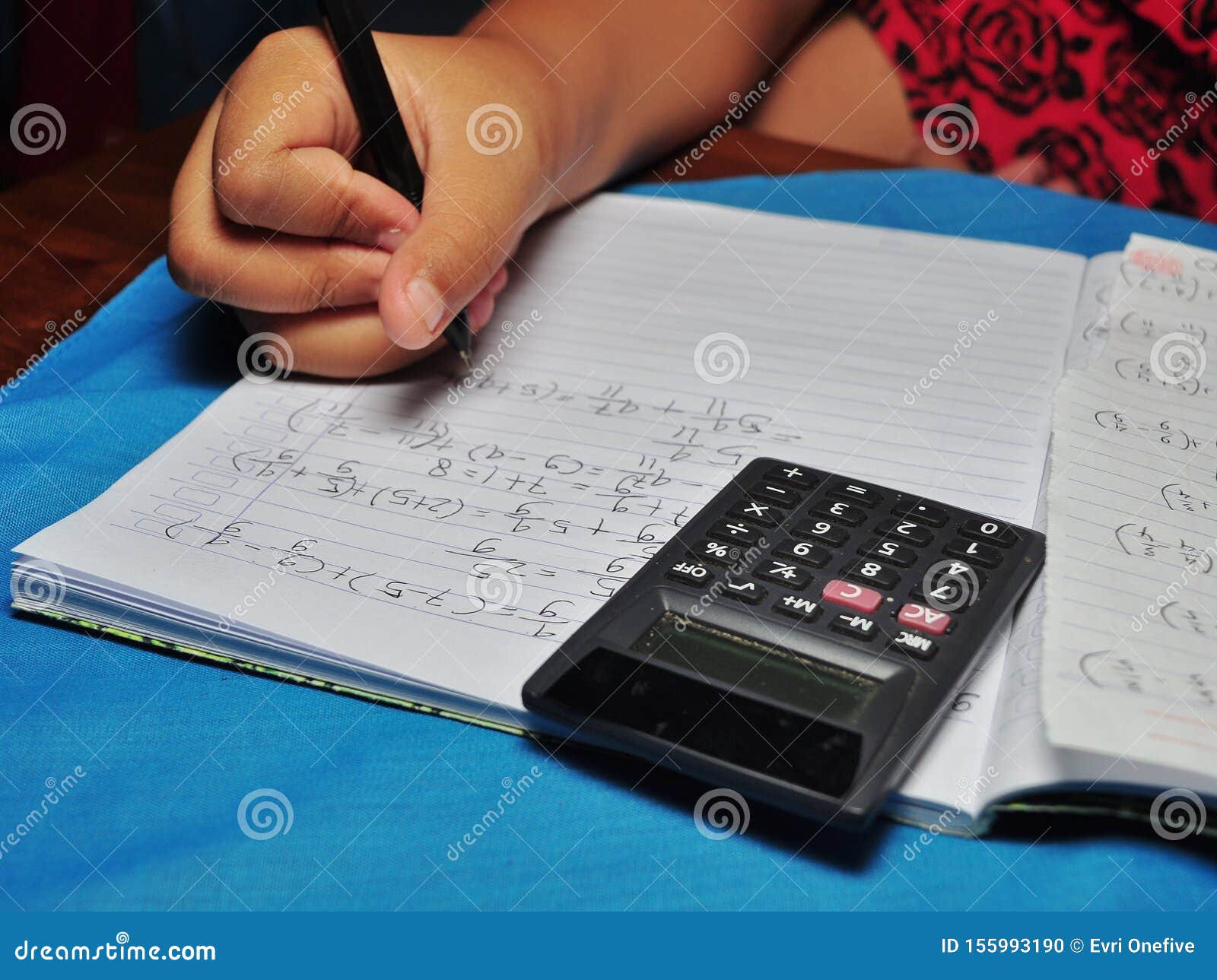 Student Answer Mathematic Question Sheet. Hand Holding Pen Writing And ...
