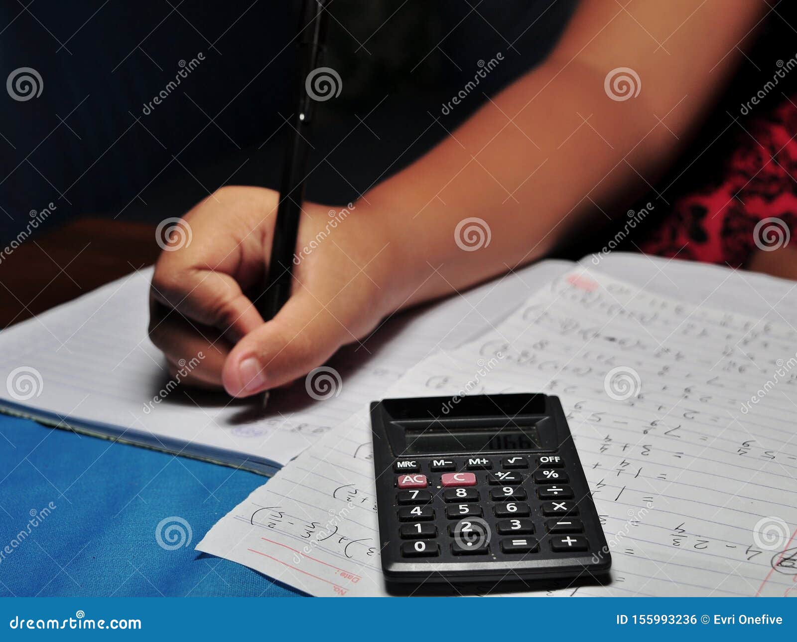 Student Answer Mathematic Question Sheet. Hand Holding Pen Writing And ...