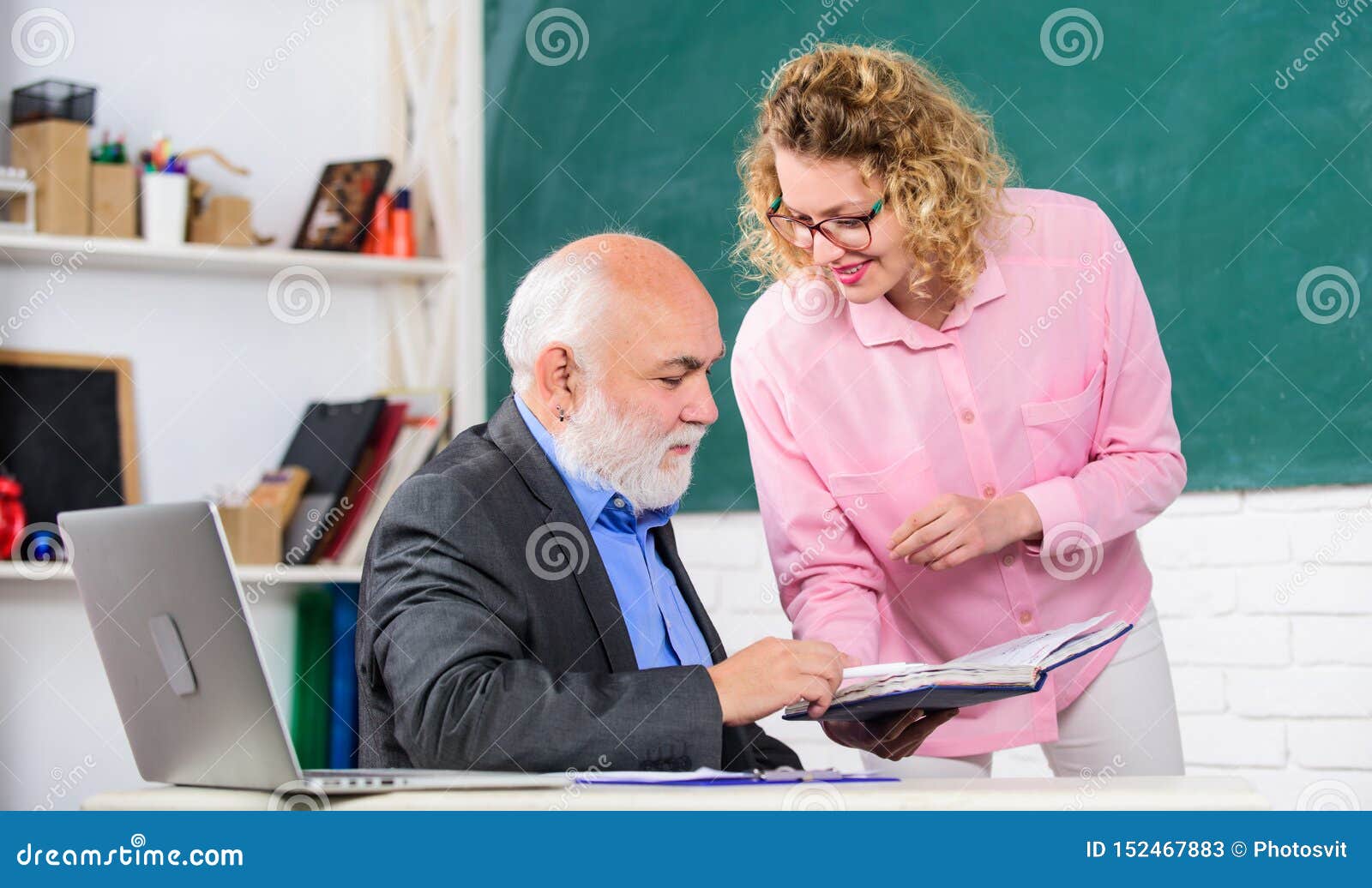 Student Asking Teacher about Task. Educator and Pupil Looking at Book ...
