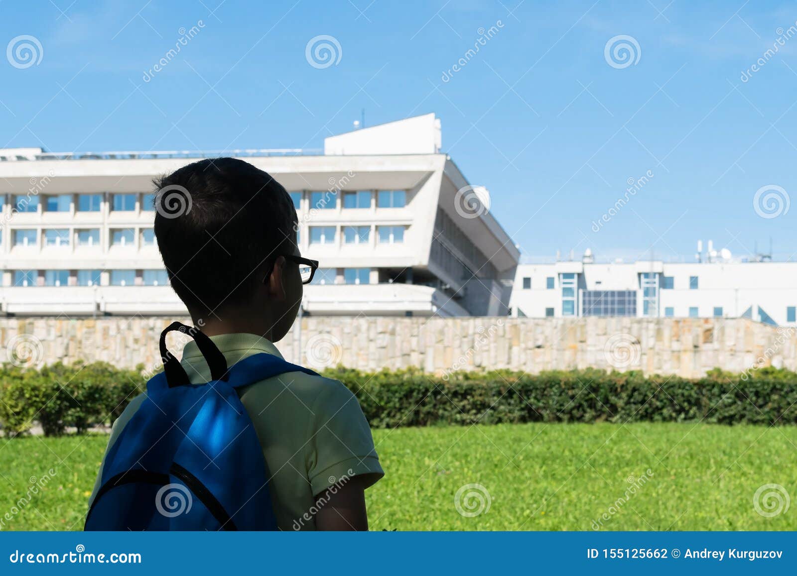 Student with a Backpack on His Back Looks at the School Building Stock ...